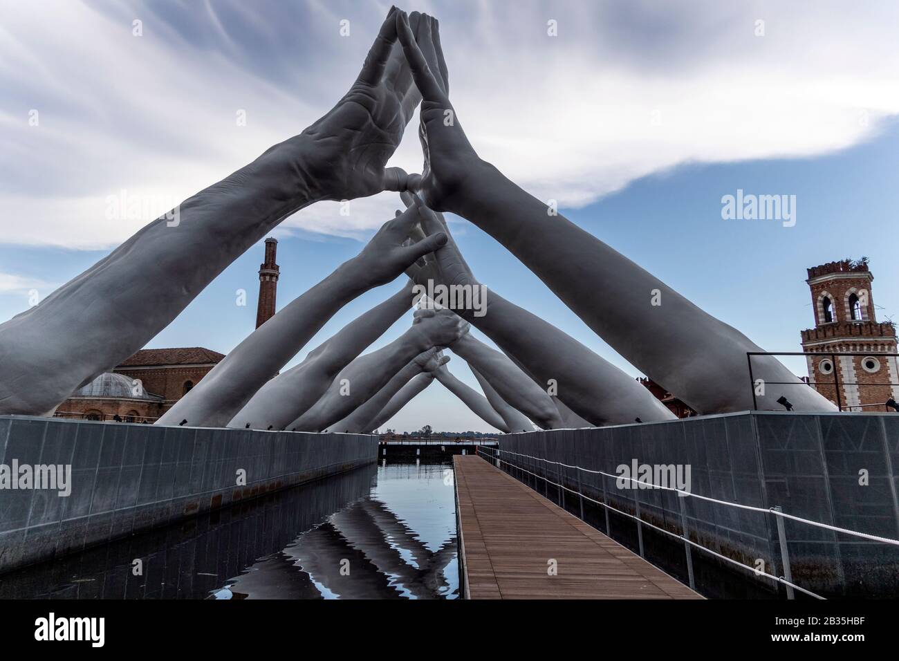 Italian artist Lorenzo Quinn builds bridges over Venice Arsenale, Italy ...