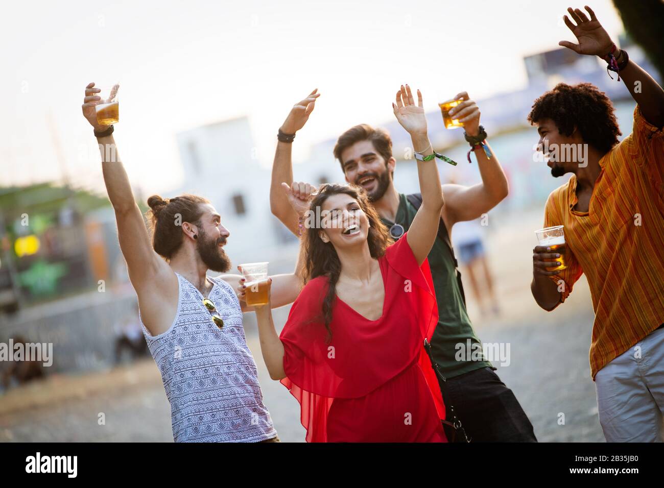 Happy friends laughing and having fun outdoors Stock Photo - Alamy