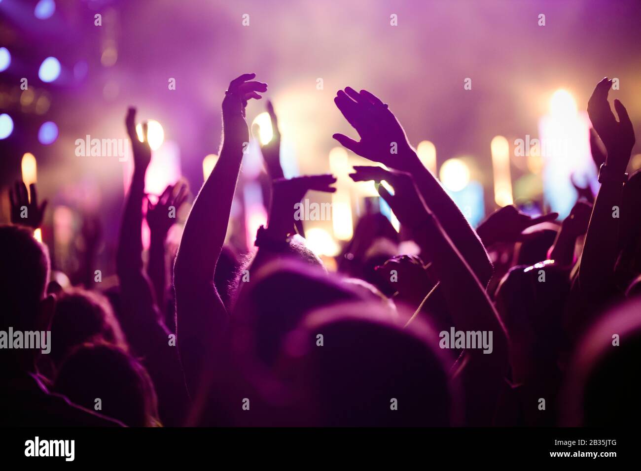Concert crowd cheering hands up hi-res stock photography and images - Alamy