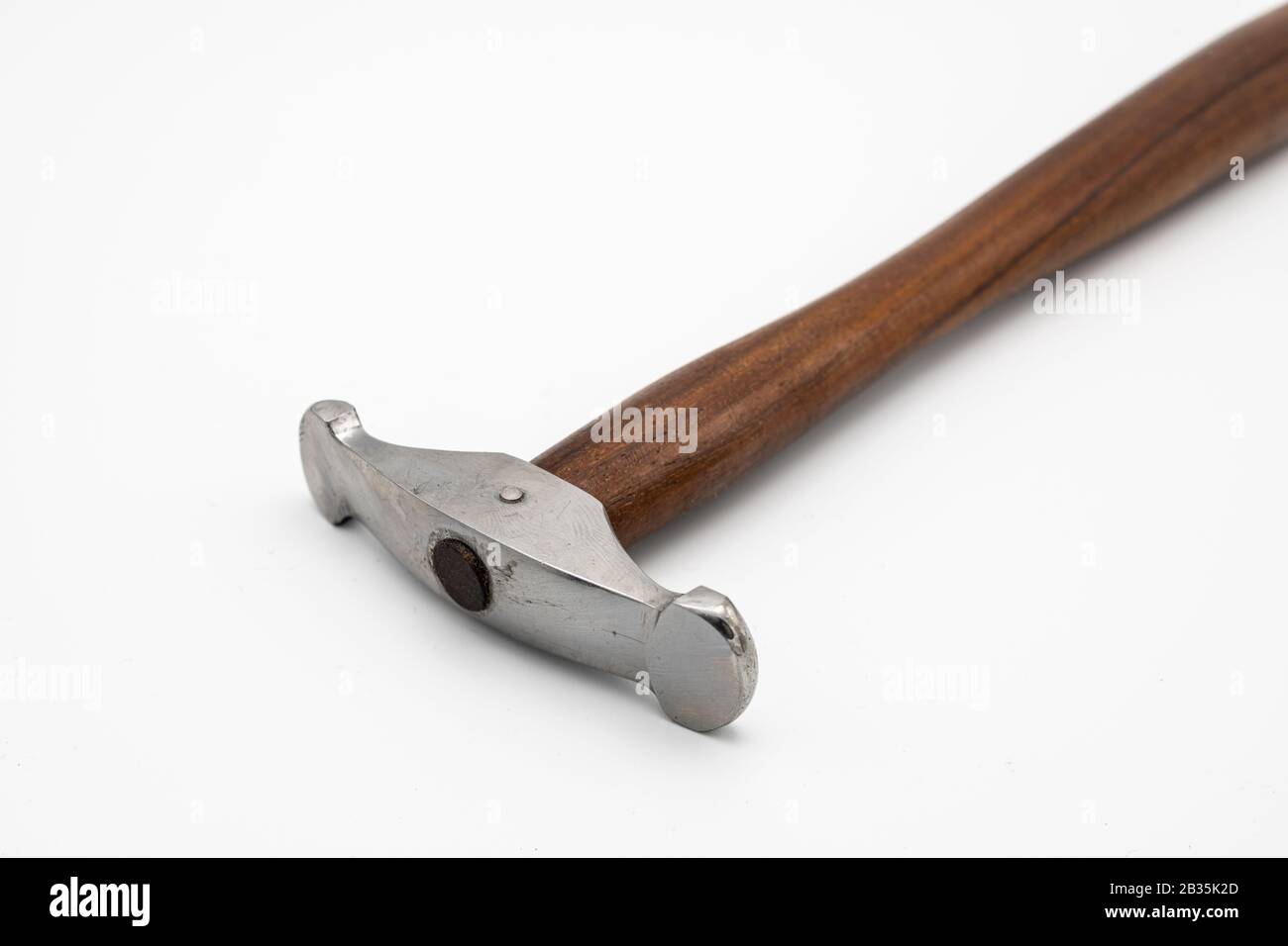 Closeup of a chasing hammer lying on a white background Stock Photo - Alamy