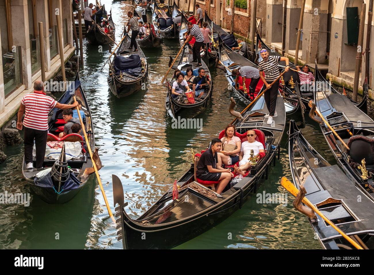 Over crowded canal, tourists on gondola's, Venice, italy Stock Photo ...