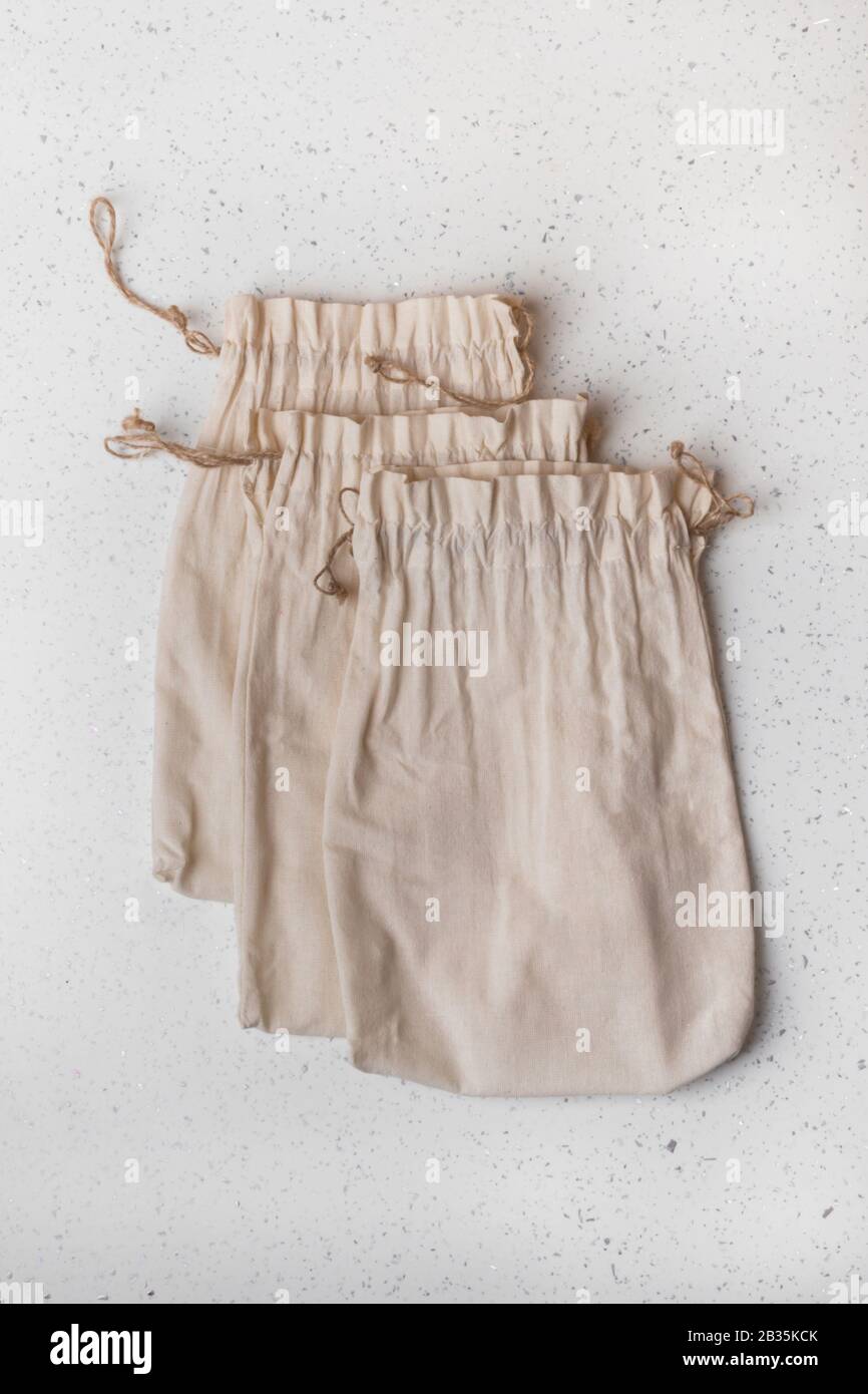 empty purse string cotton bags on white background, concept for save ...