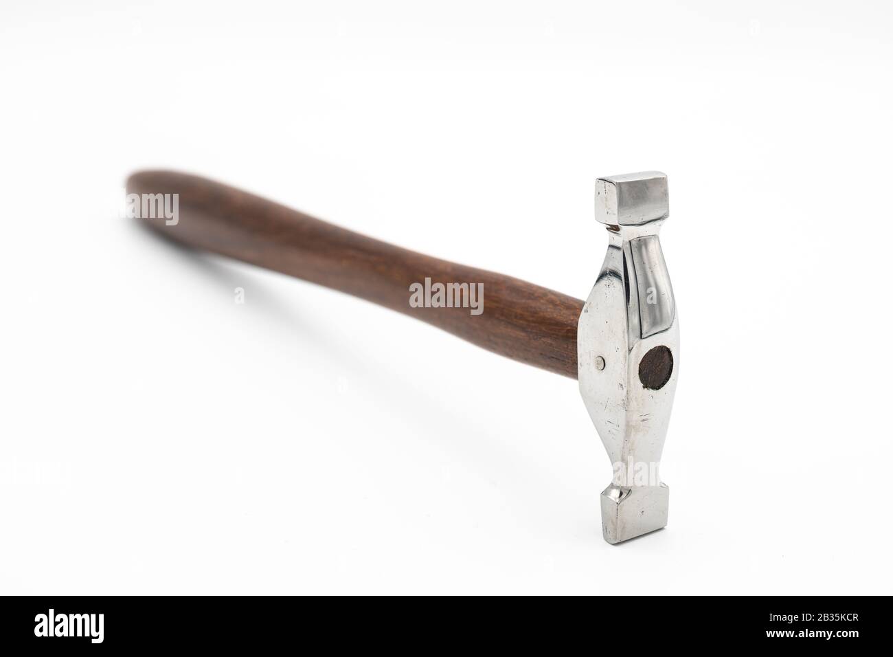 Closeup of a chasing hammer lying on a white background Stock Photo - Alamy