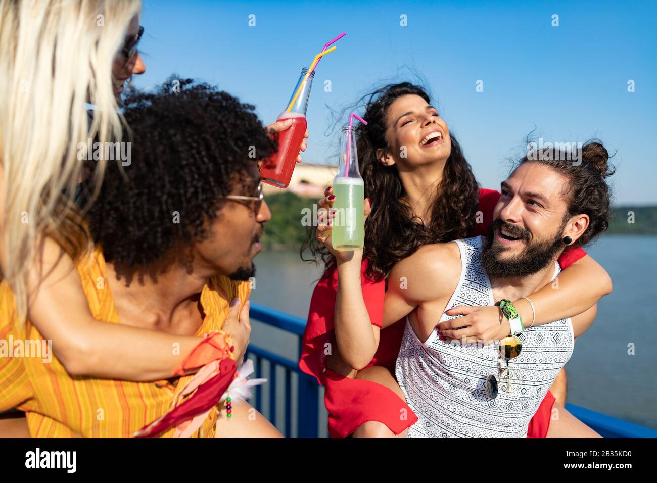 Group of young friends having fun together outdoor Stock Photo - Alamy