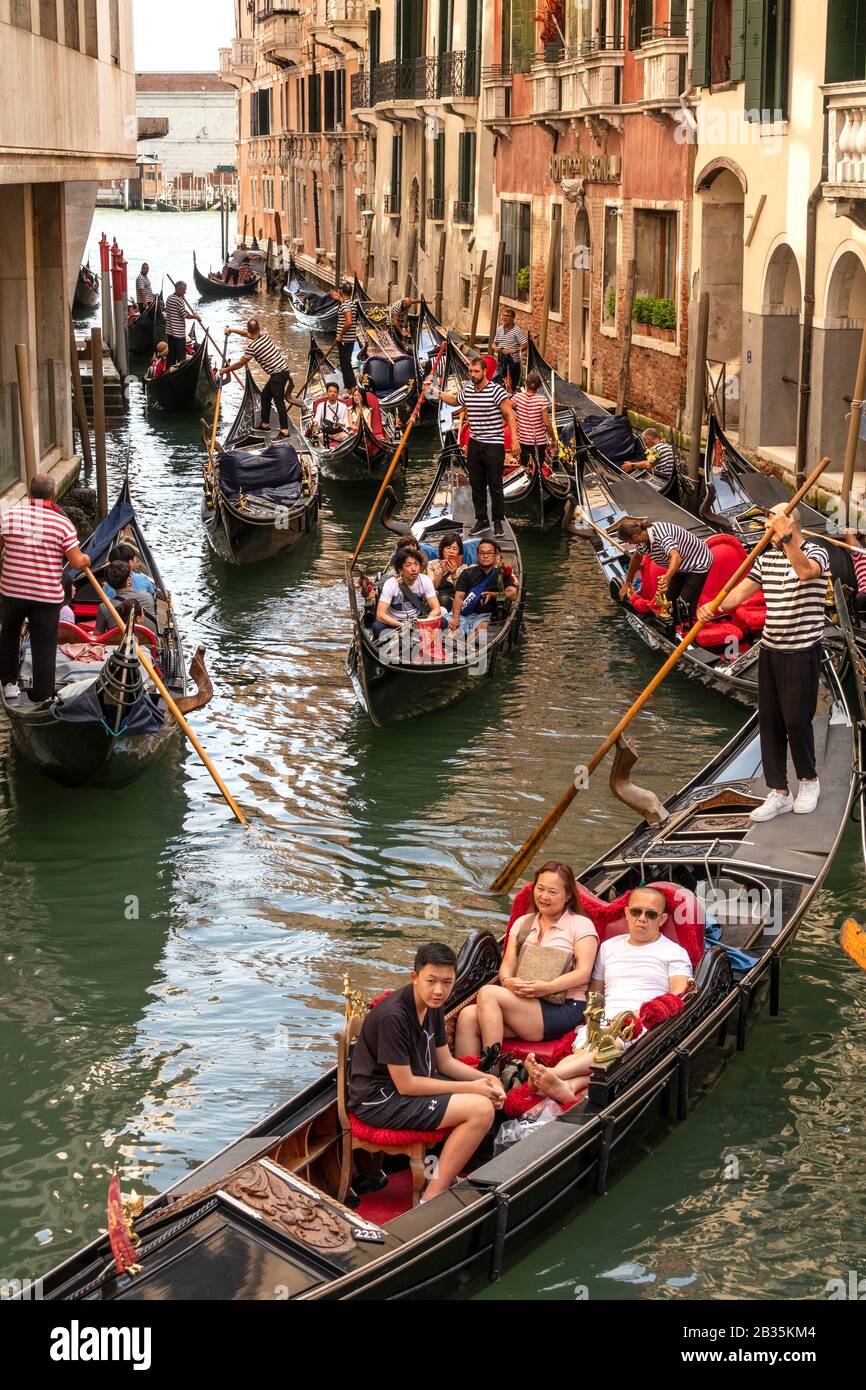 Over crowded canal, tourists on gondola's, Venice, italy Stock Photo ...