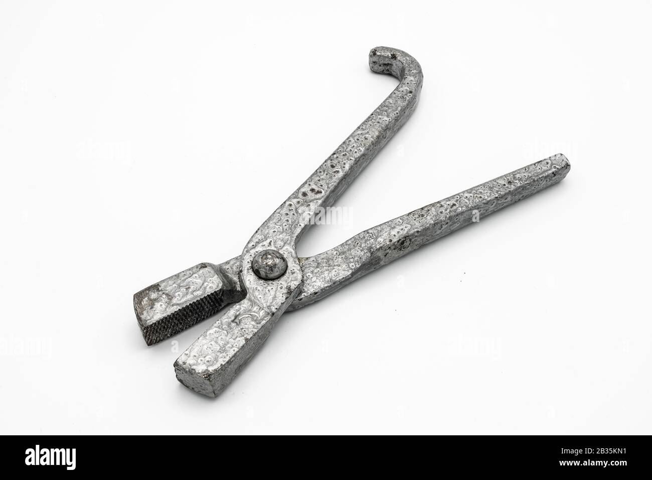 Closeup of wire pulling pliers lying on a white background Stock Photo ...