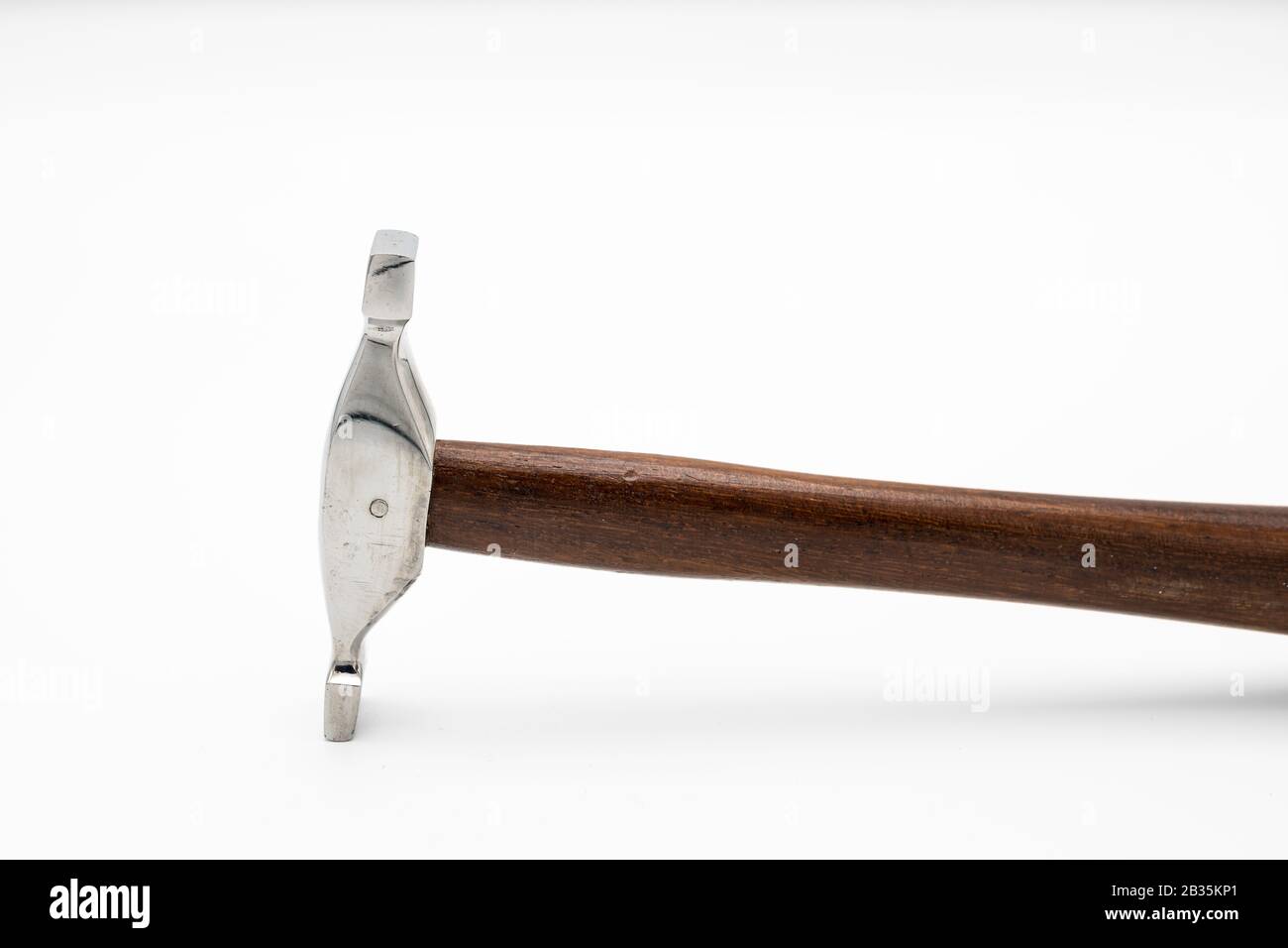 Closeup of a chasing hammer lying on a white background Stock Photo - Alamy