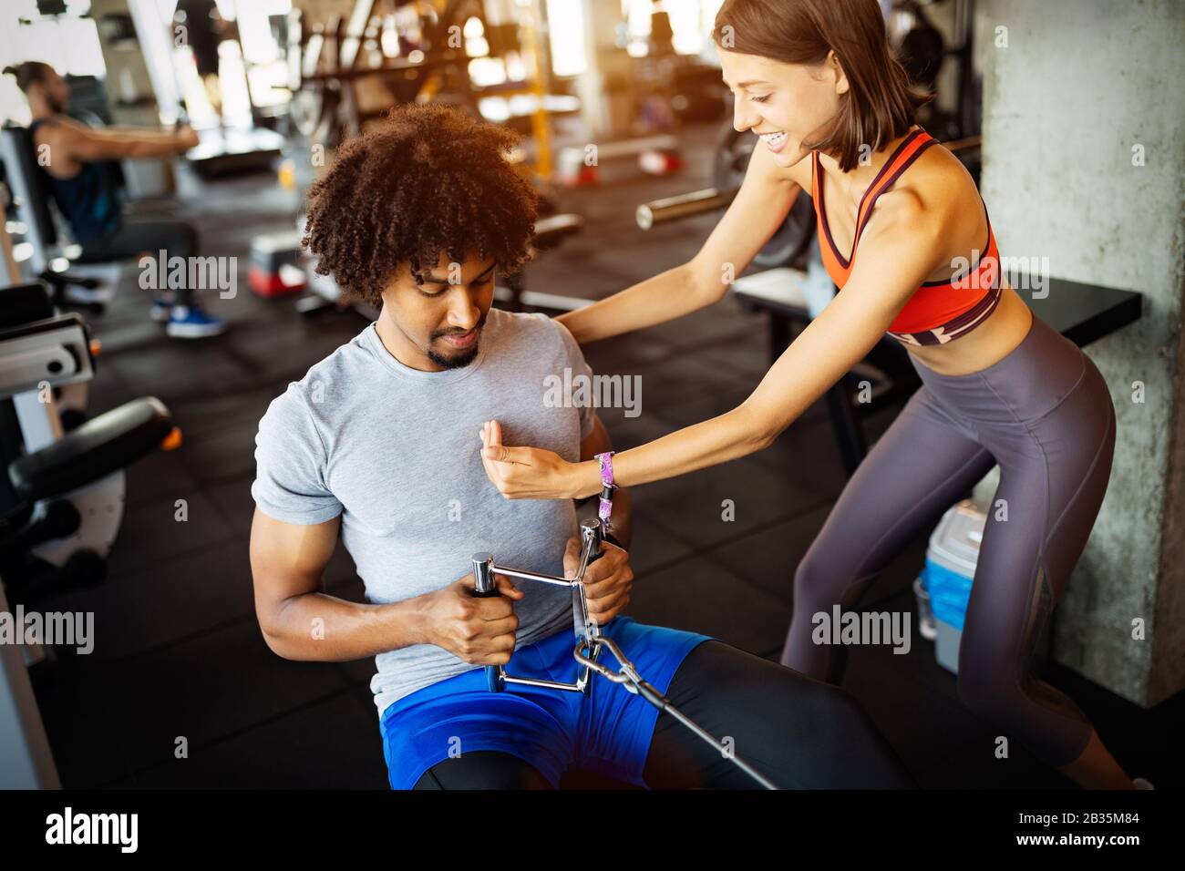 Beautiful fit people working out in gym together Stock Photo - Alamy