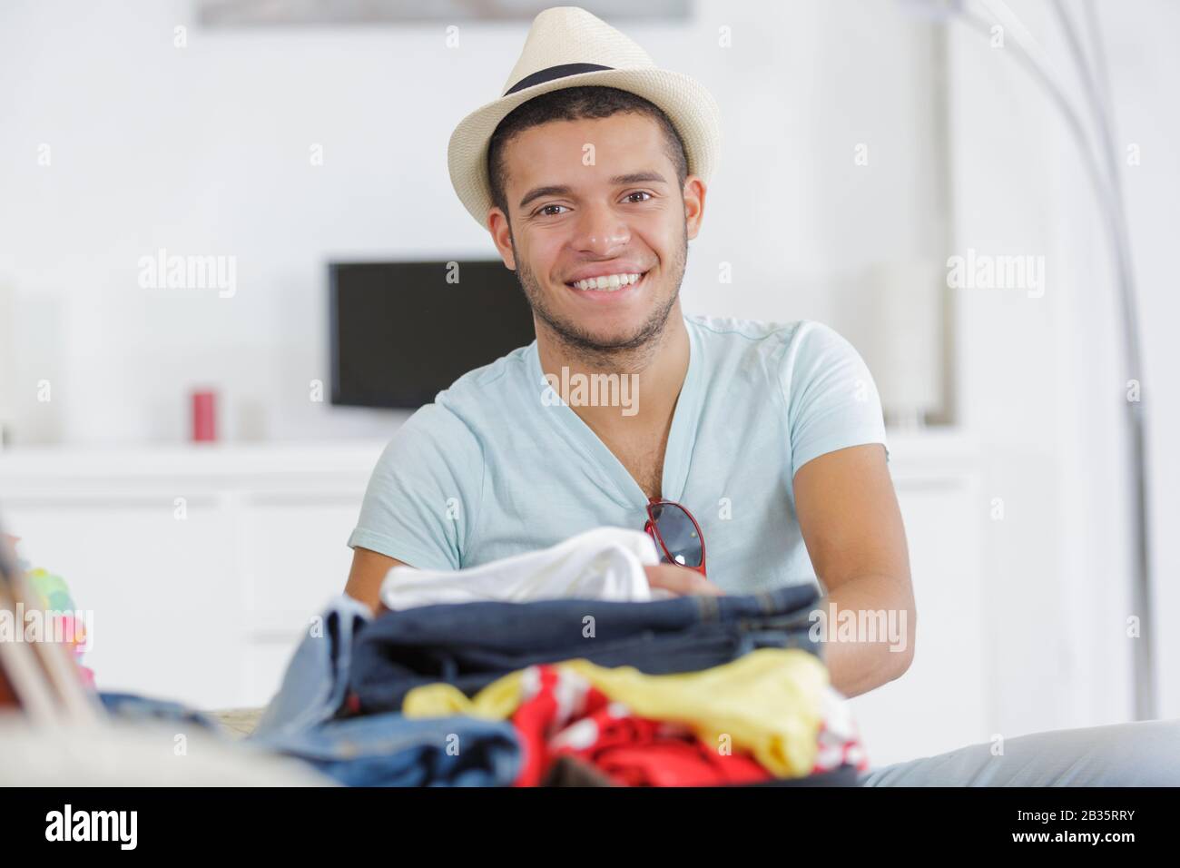 picture of a man doing his packing Stock Photo - Alamy