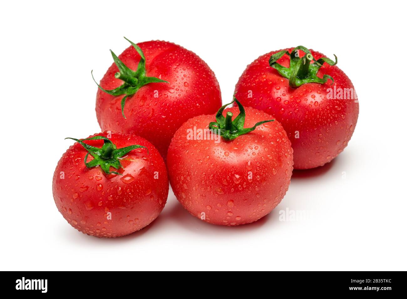 Four fresh red tomatoes isolated on white background Stock Photo - Alamy