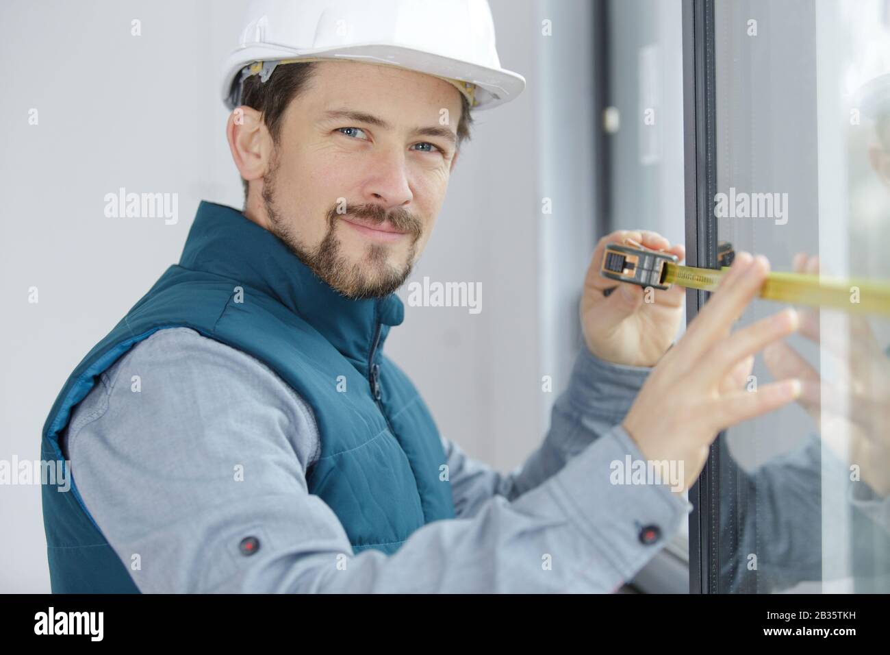 male engineer is using a meter Stock Photo - Alamy