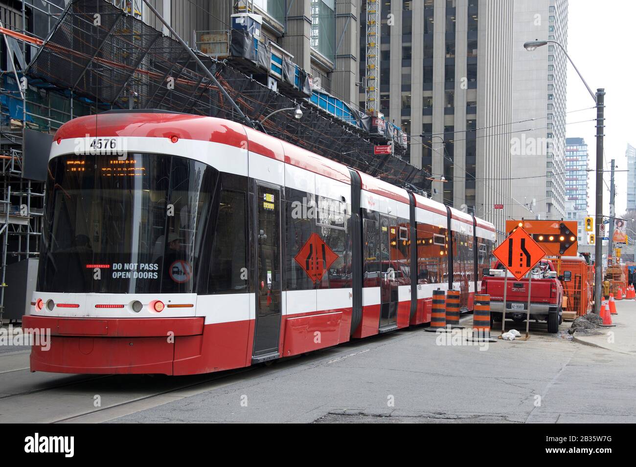 Toronto Streetcar running along the tram lines on Downtown Toronto ...