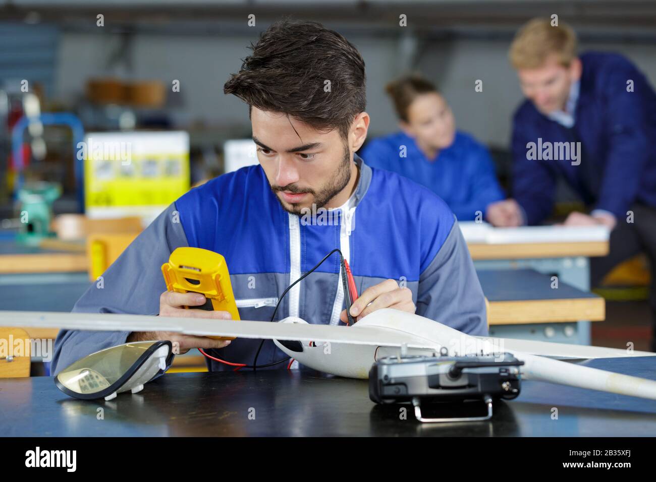 trainee aircraft engineer using a multimeter Stock Photo - Alamy