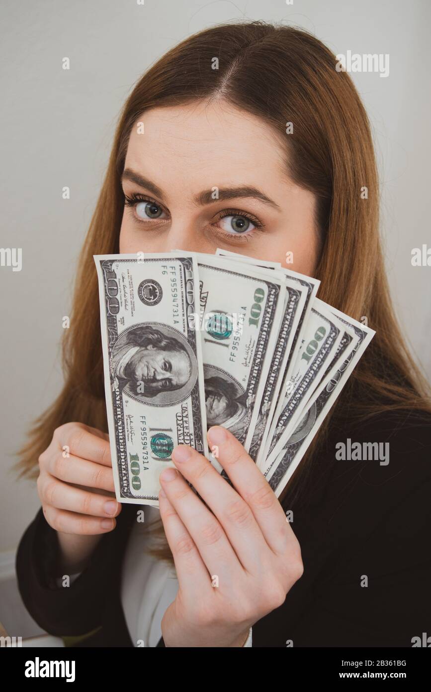 woman face covered with money currency dollars one hundred Stock Photo ...