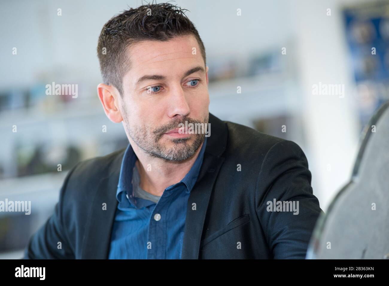 portrait of busy suited businessman Stock Photo - Alamy