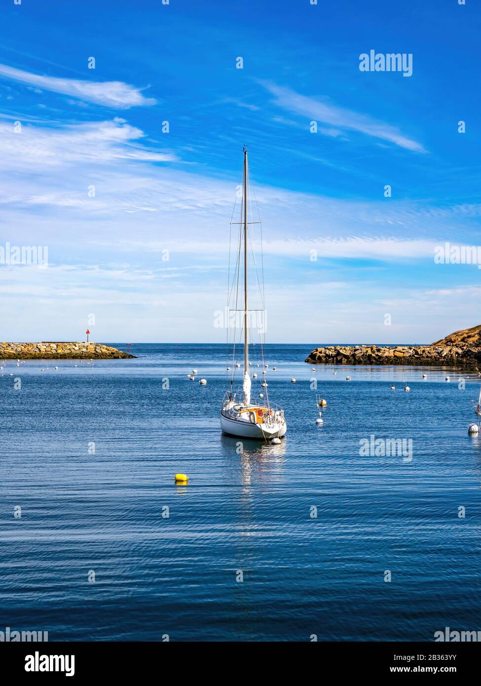 sailboat anchored in the bay Stock Photo - Alamy