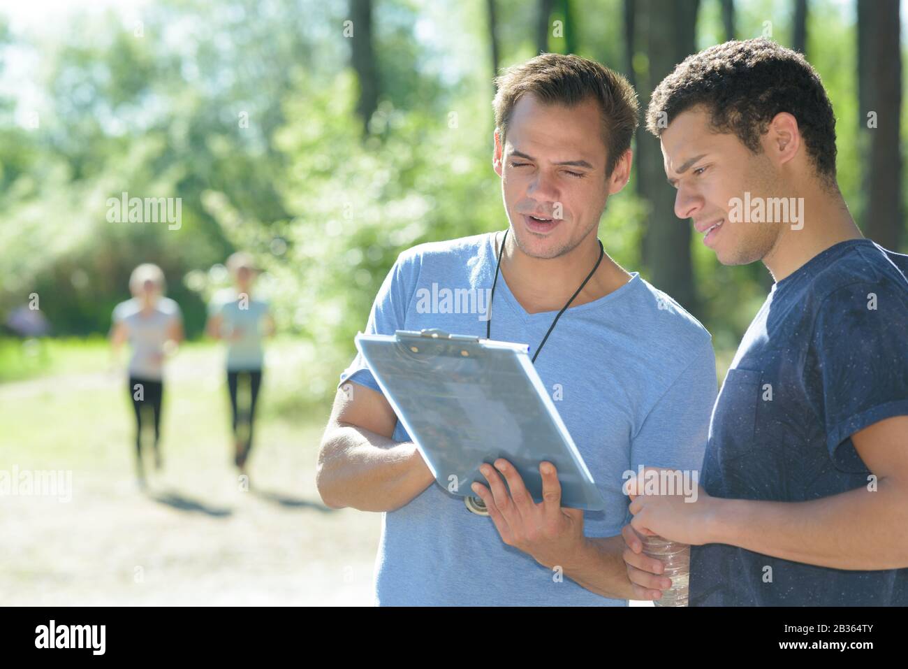 Two fitness instructor talking hi-res stock photography and images - Alamy
