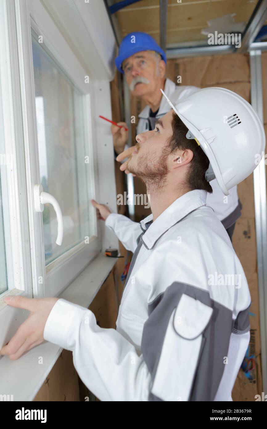 portrait of windows installation workers Stock Photo - Alamy