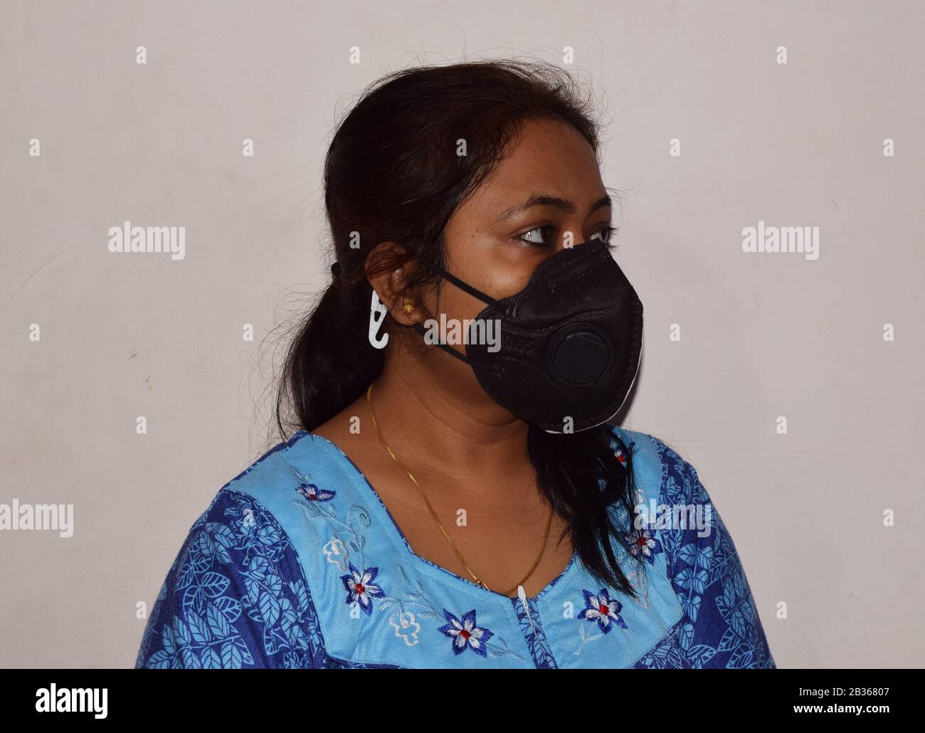 Corona Virus Prevention - An Indian wearing protective face mask to ...