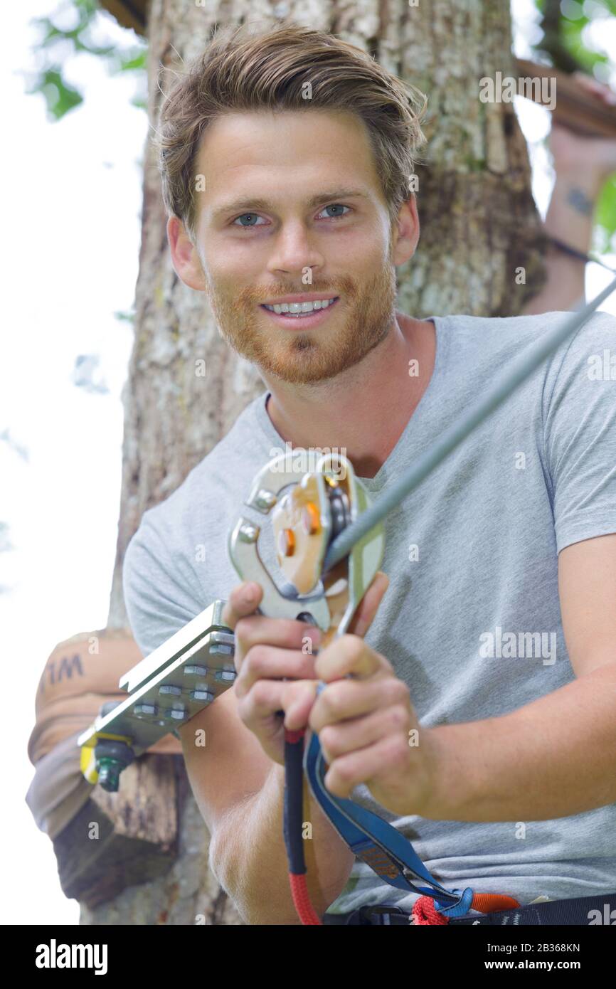 man in adventure park in forest Stock Photo - Alamy