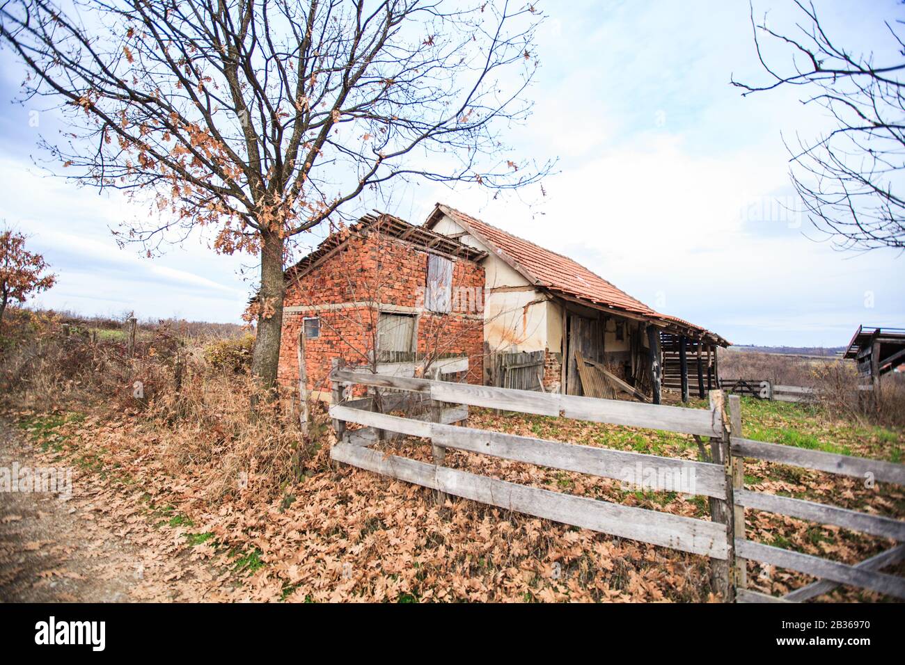 Traditional rural house and farm, countryside landscape, a village in ...