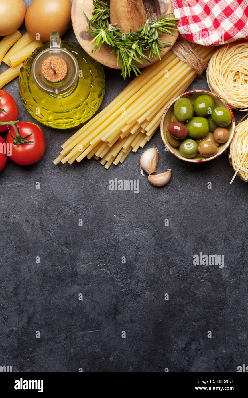 Italian cuisine food ingredients. Pasta, cheese, olives and tomatoes ...