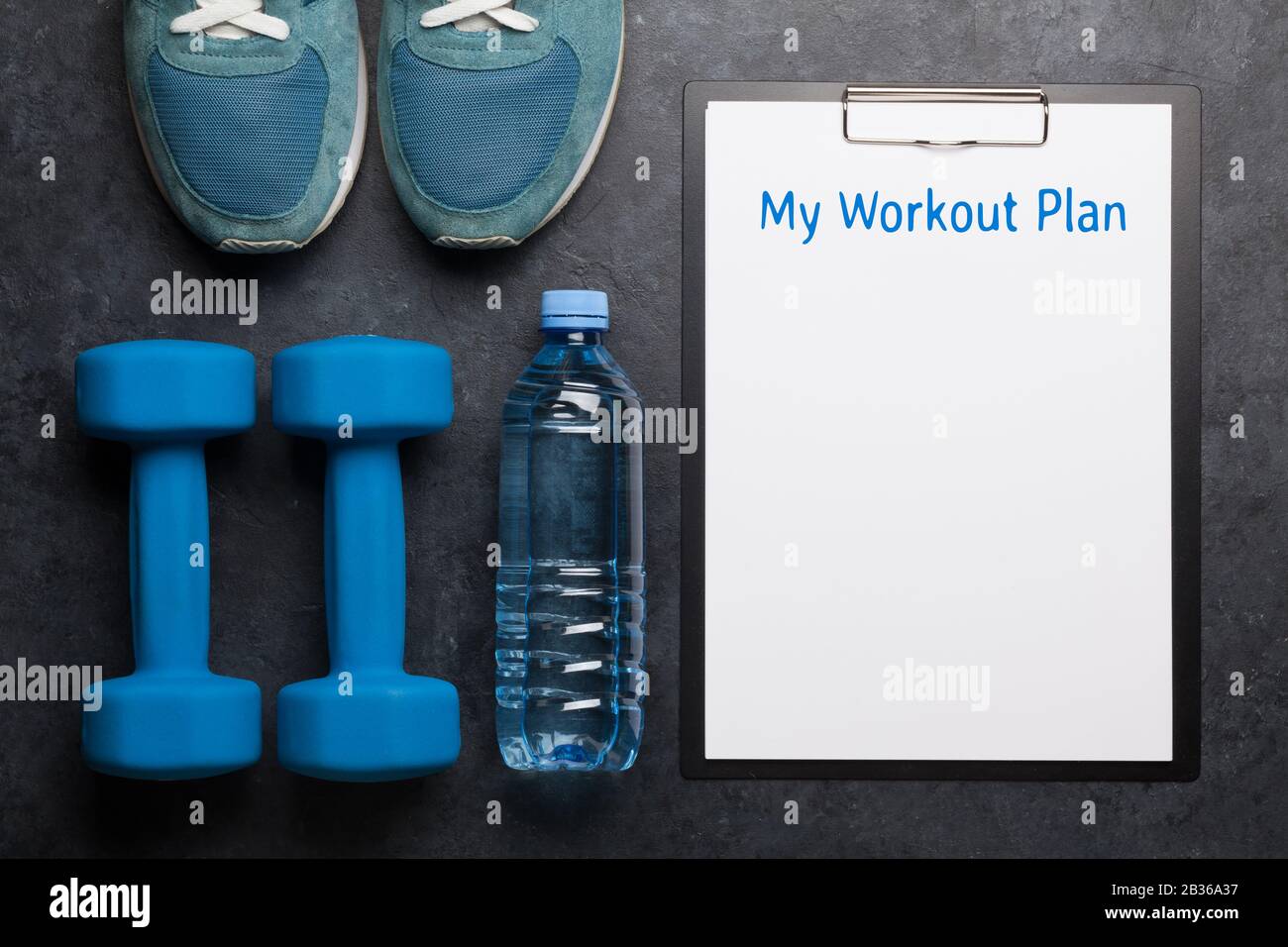 Fitness equipment and blank sheet for workout plan on a stone ...
