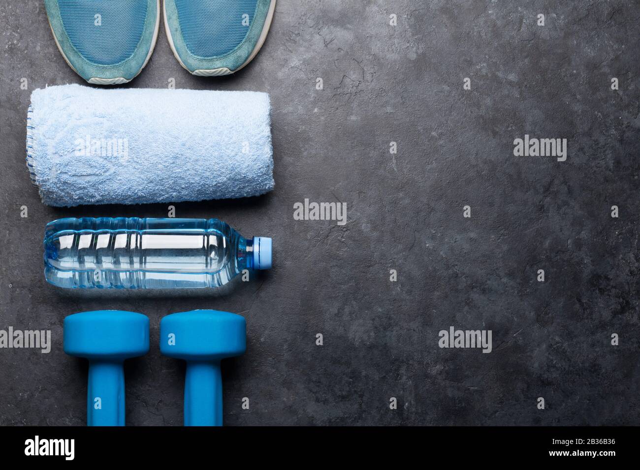 Fitness equipment on a stone background. Top view flat lay with copy ...