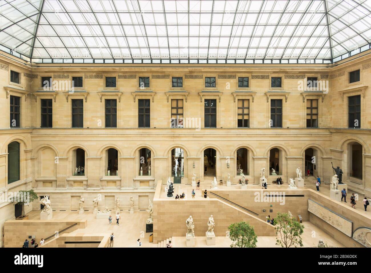 Symmetrical picture of Louvre's amazing sculpture courtyard. Paris ...