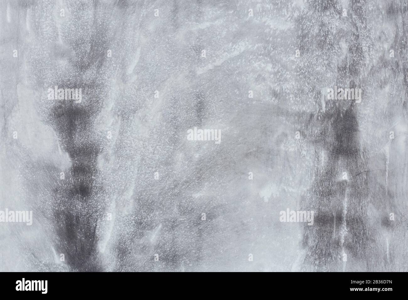 A smooth surface of a concrete formwork wall with various shades of ...