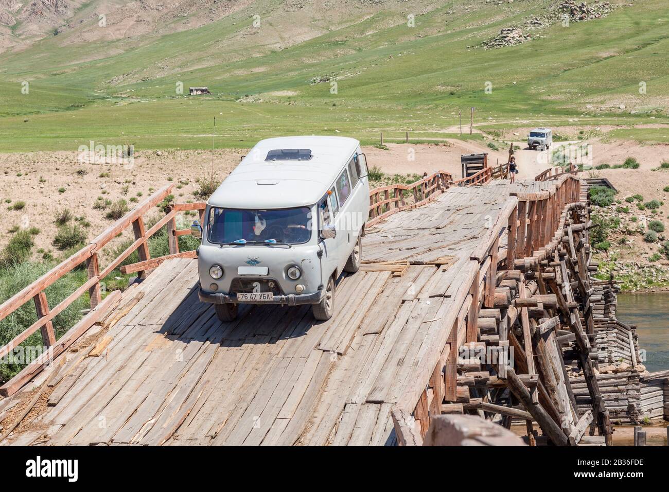 Mongolia, Khovsgol province, Russian minibus UAZ 452 crossing the Ider ...