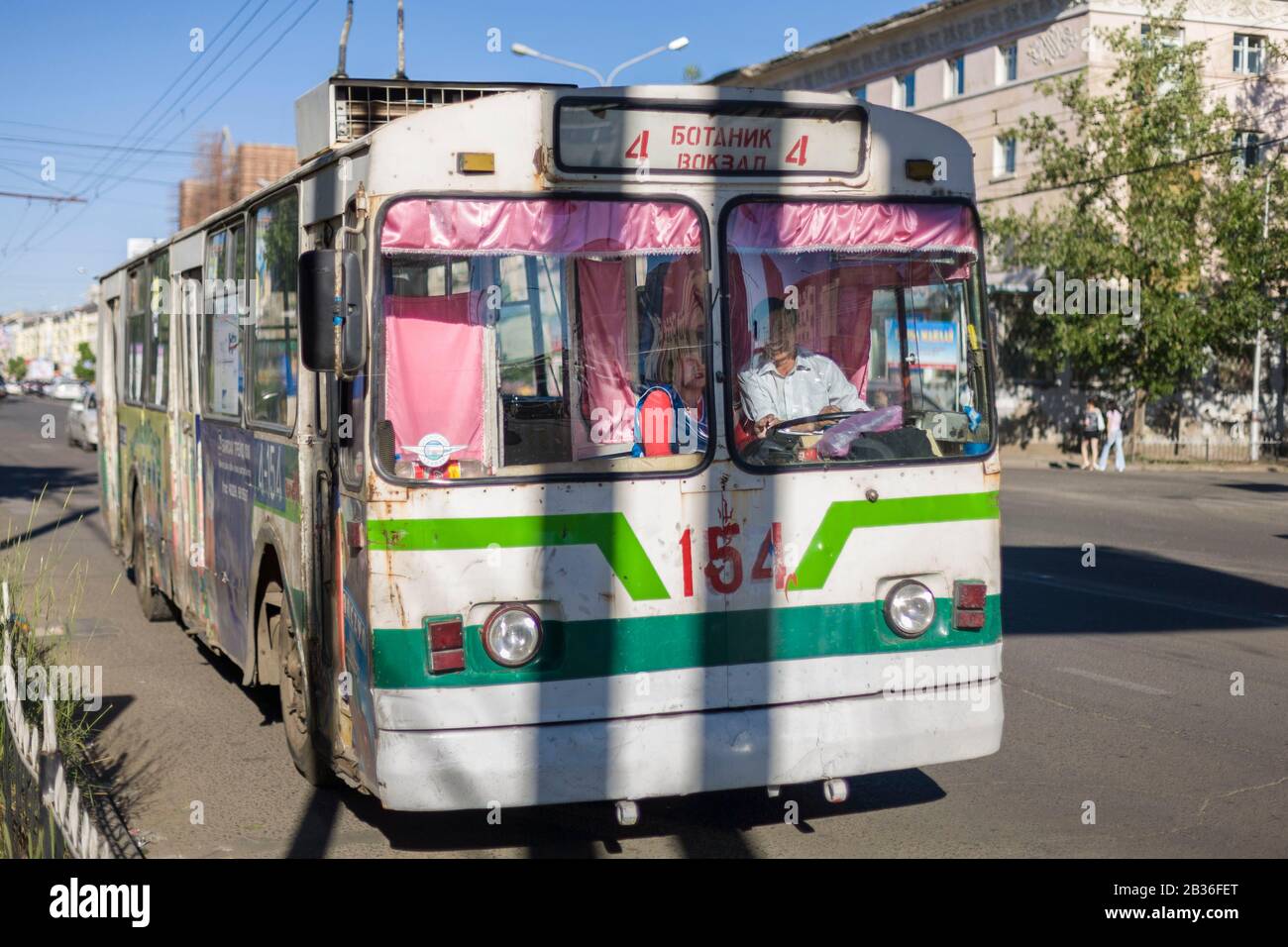 Mongolia, Ulan Bator, driver and trolleybus in an avenue Stock Photo ...