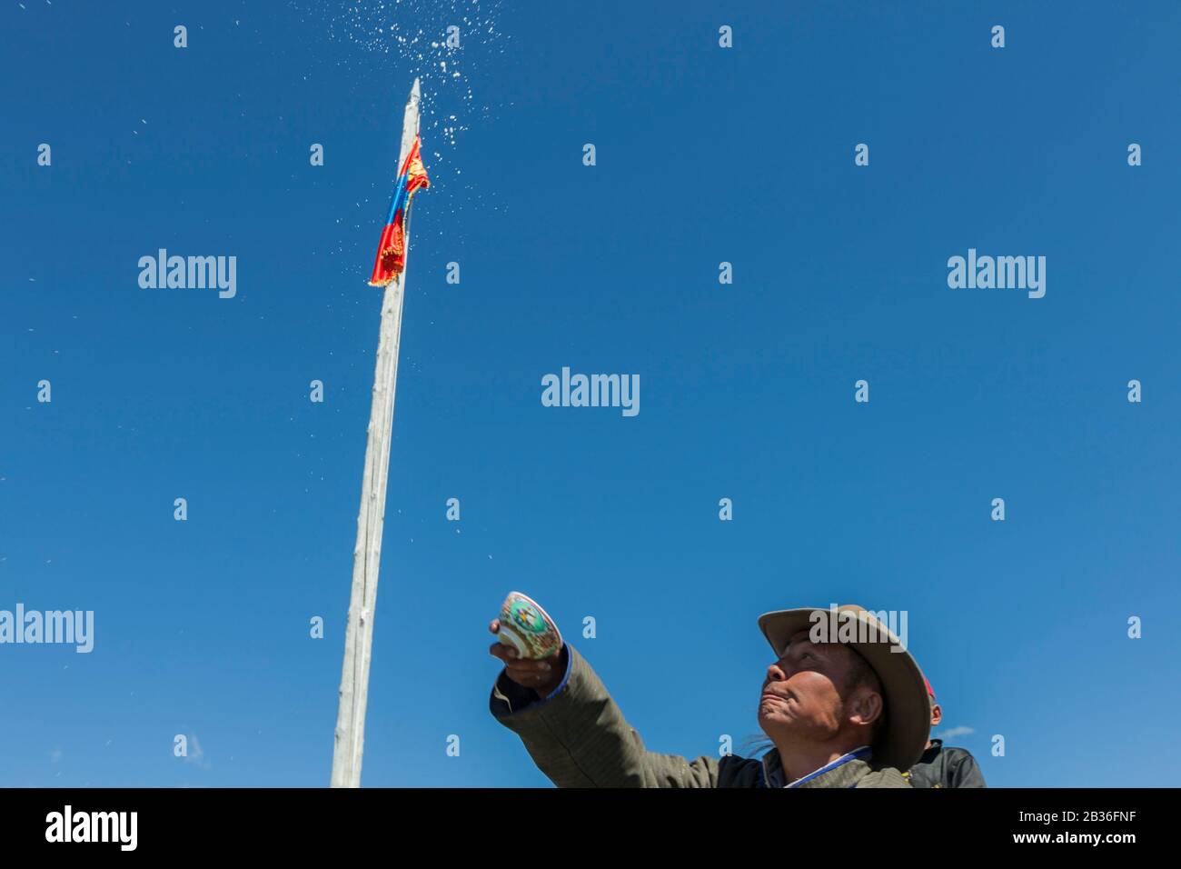 Mongolia, Khovsgol province, Tsagaannuur, Naadam ritual, man throwing ...