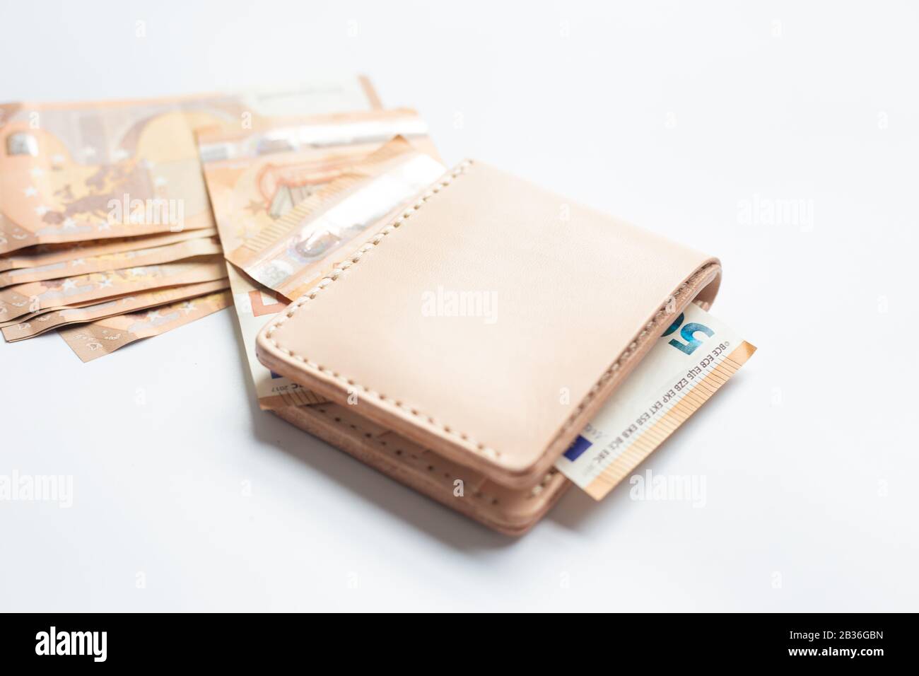 Leather wallet with euro money bill on white background financial ...