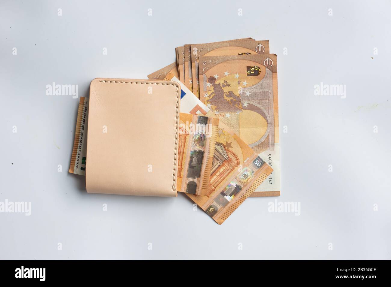 Leather wallet with euro money bill on white background financial ...