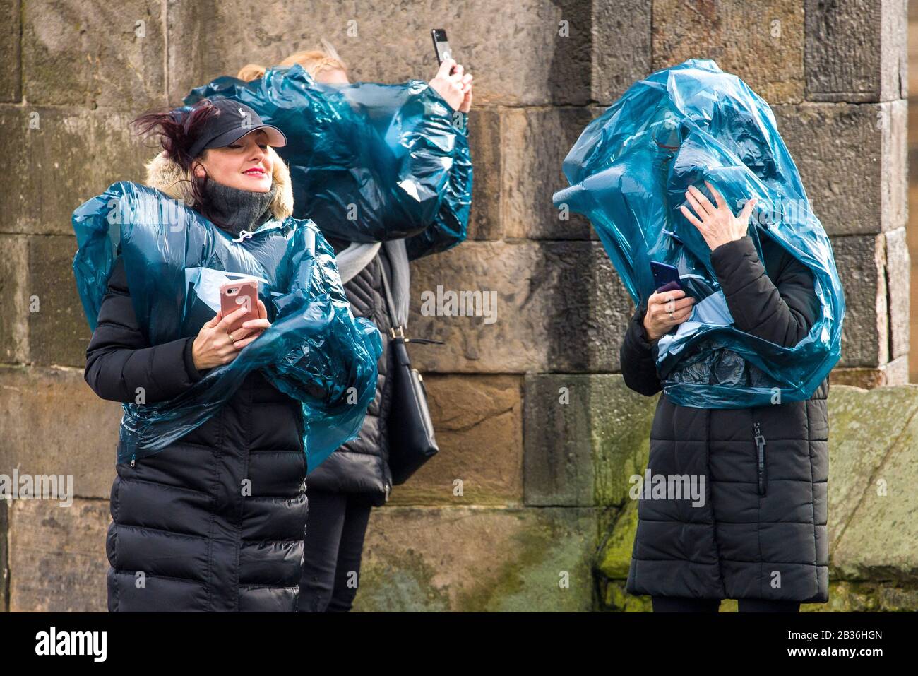 Tourists in Edinburgh struggle with Storm Dennis's high winds and rain ...