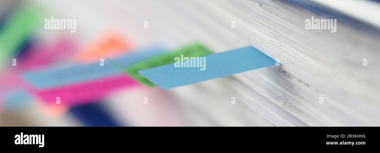 Close up color stickers between documents folder Stock Photo - Alamy