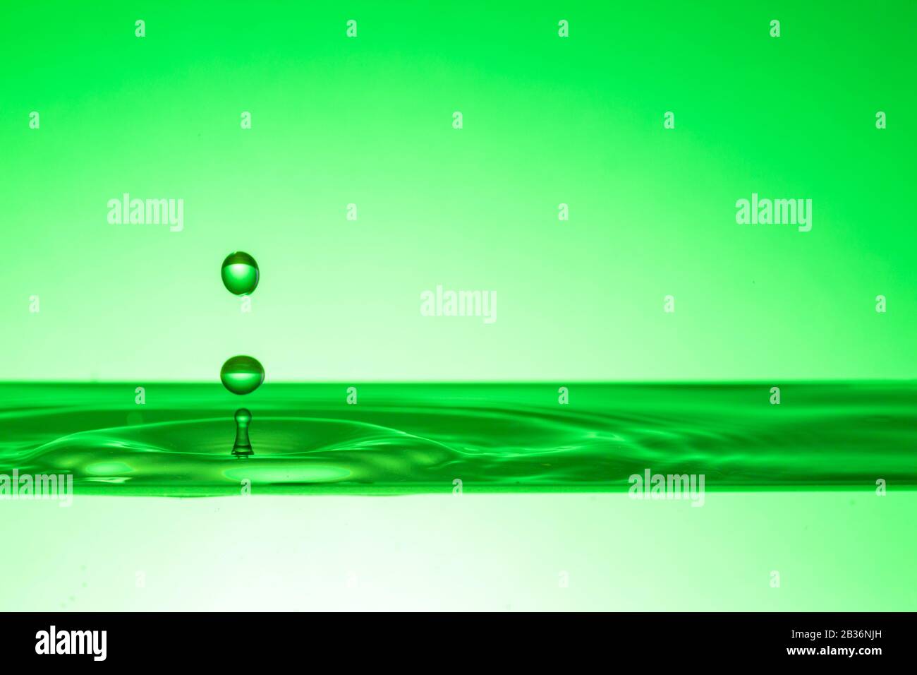 Drop falling in water Stock Photo - Alamy