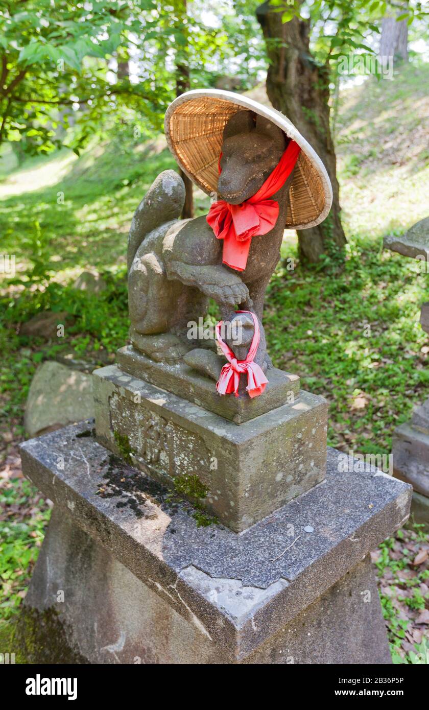 Statue of kitsune in straw hat in Inari Shinto Shrine of Aizu-Wakamatsu ...