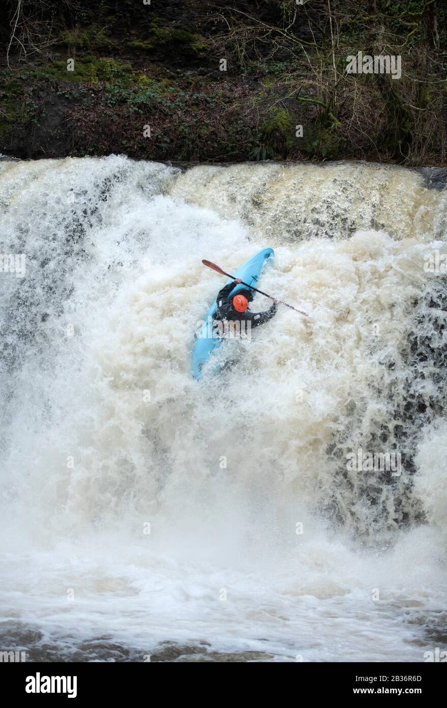 A kayaker take advantage of high water on the River Mellte near ...