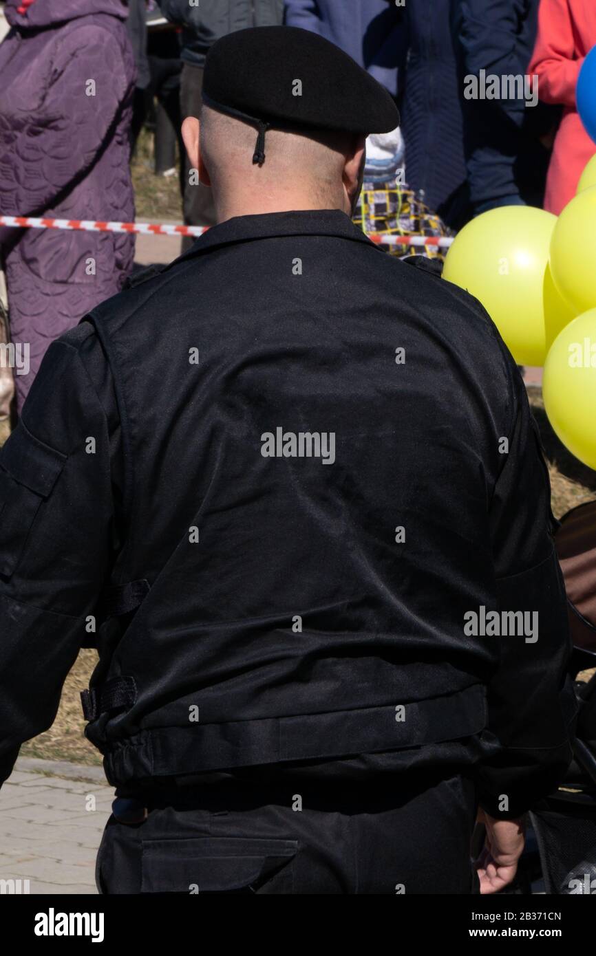 A military man in a black beret with tears in his eyes and cheek ...