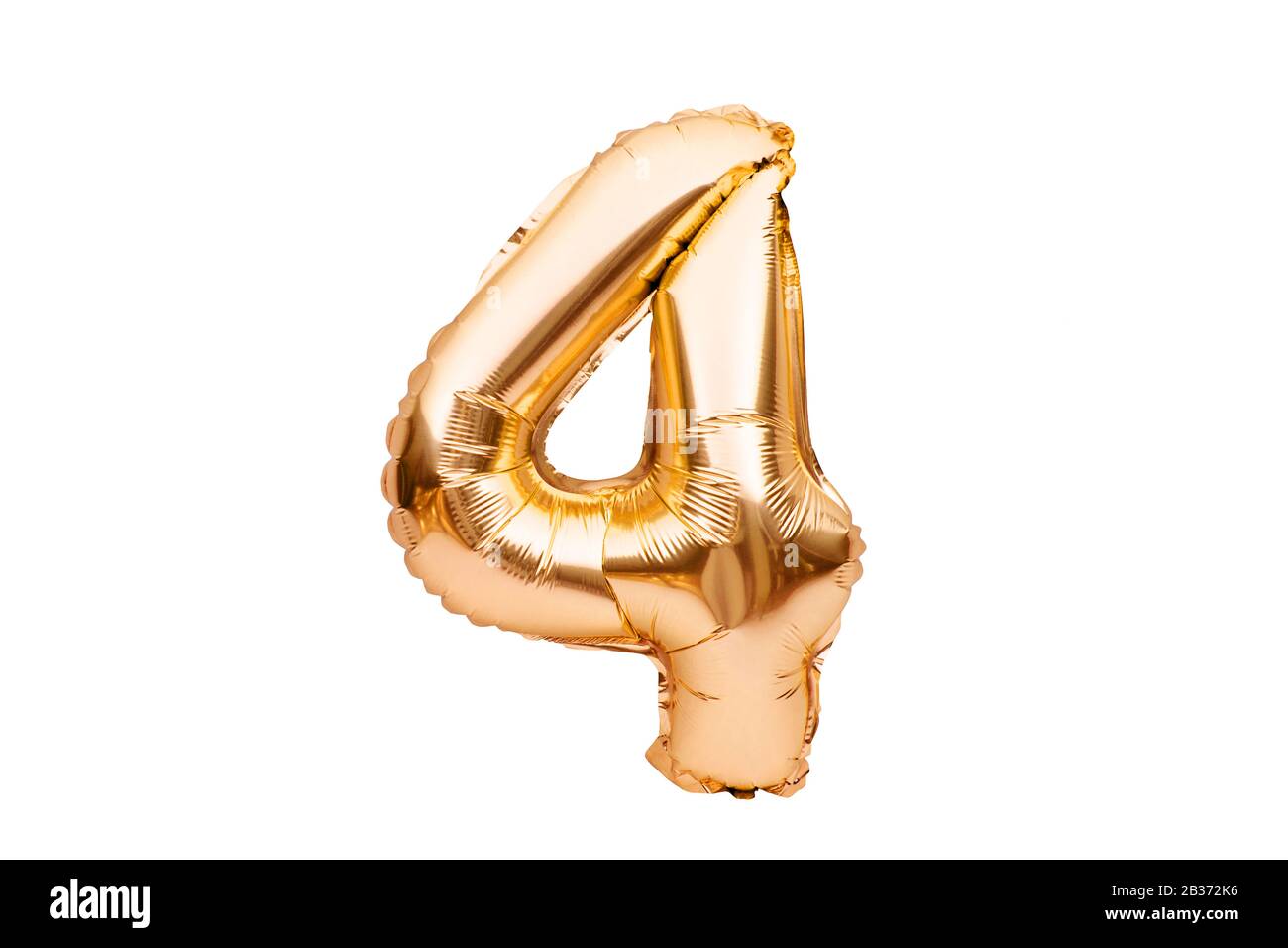 Number 4 four, made of golden inflatable helium balloon. Gold foil ...