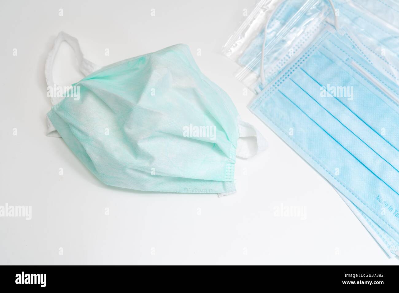 Surgical mask with rubber ear straps. Typical 3-ply surgical mask to ...