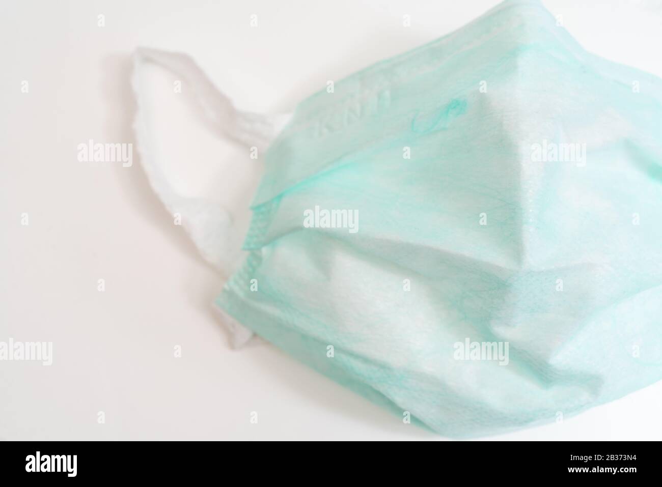 Surgical mask with rubber ear straps. Typical 3-ply surgical mask to ...