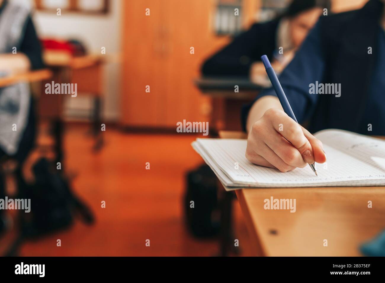 Students writing exam uniform hi-res stock photography and images - Alamy