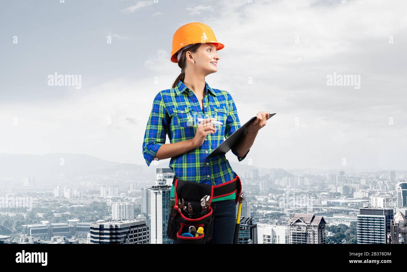 Young building inspector checking outdoor Stock Photo - Alamy