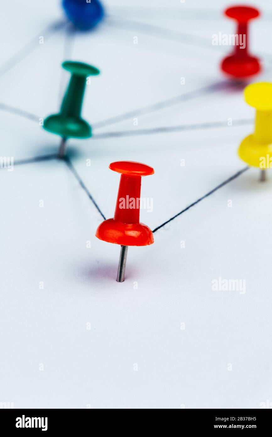 pins connected creating a network. creative photo Stock Photo - Alamy
