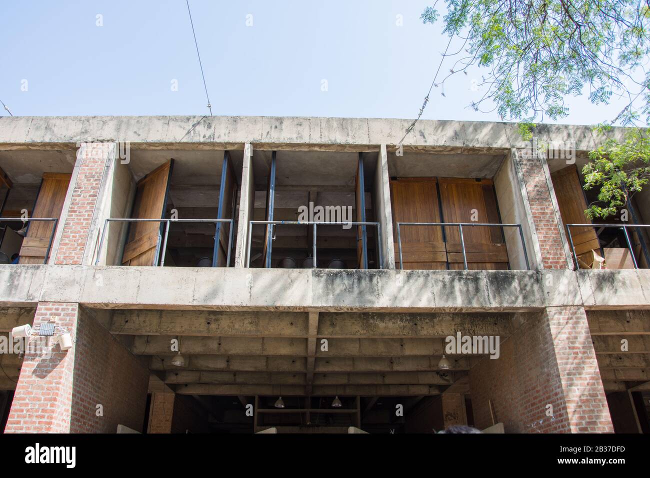 Old facade of a brick and concrete building Stock Photo - Alamy