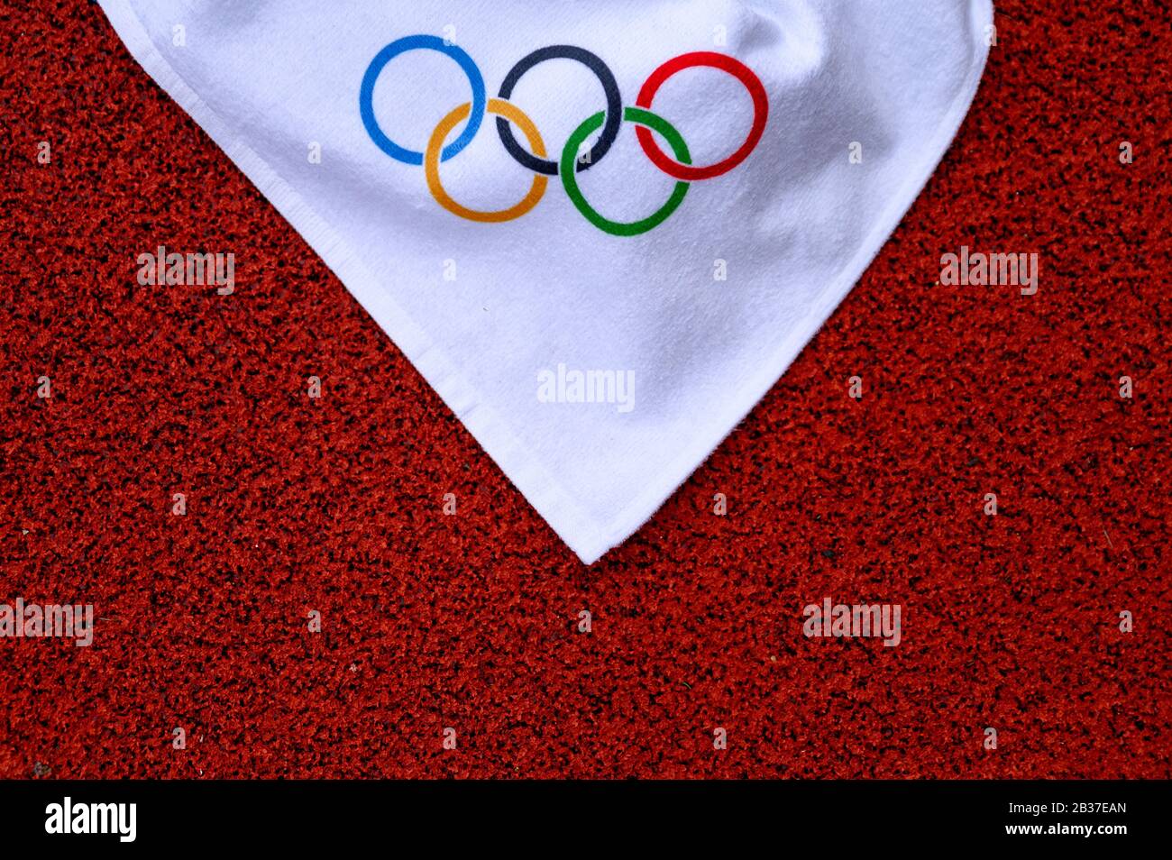 TOKYO, JAPAN, MARCH 5. 2020: Olympic rings on red athletics track ...