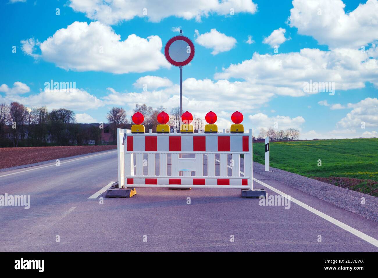 red street warning lights at road on countryside Stock Photo - Alamy